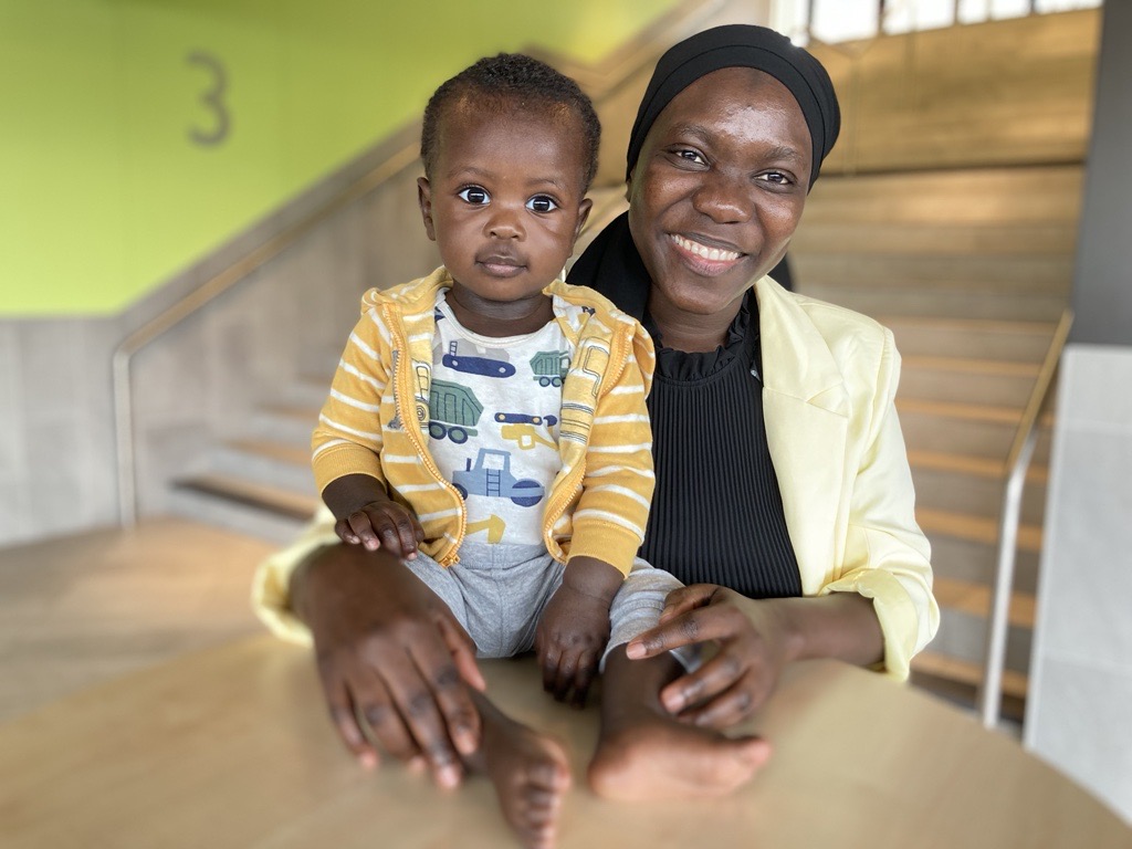Fatou Jeng, holding her son Muhammad Ali at World Water Week 2023